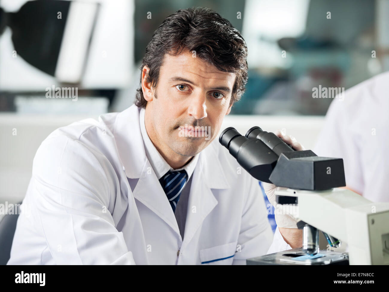 Male Scientist Using Microscope In Lab Stock Photo - Alamy