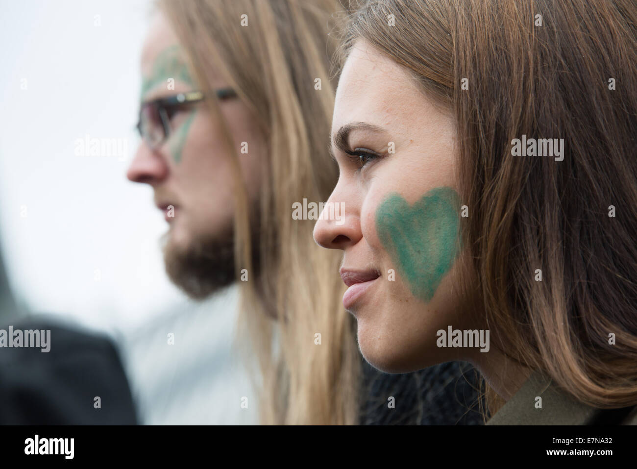 Oslo, Norway. 21st Sep, 2014. A woman and mand with green hearts ...