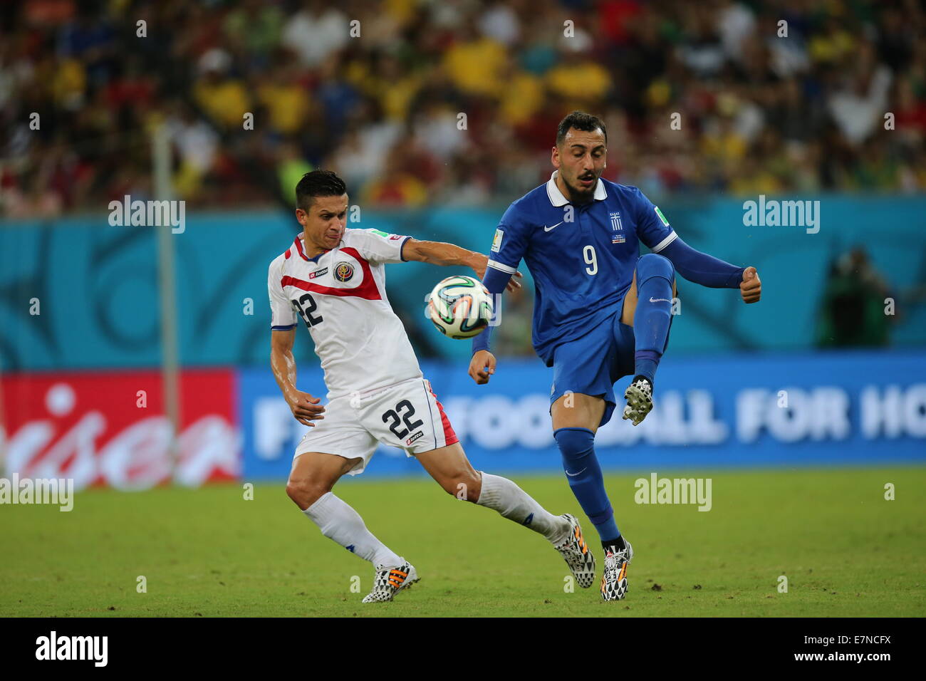 Jose Cubero of Costa Rica and Knstantinos Mitroglou of Greece. Greece v ...