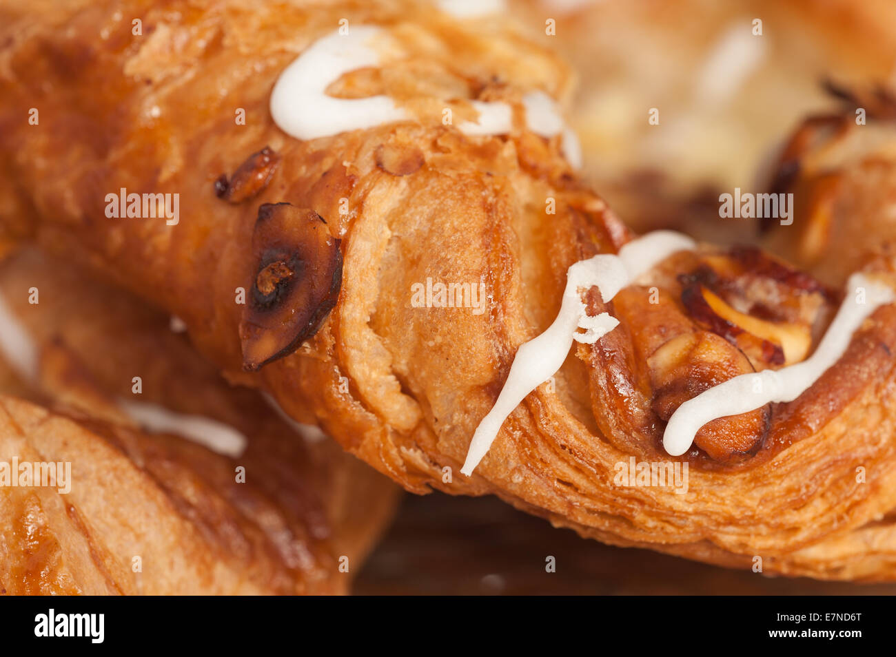 appetizing flaky puff pastry pastry with coiled strand of icing sugar ...