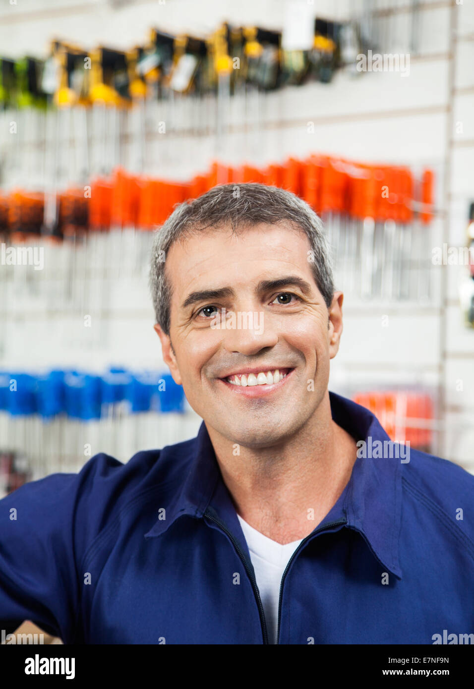 Male Worker Smiling In Hardware Shop Stock Photo - Alamy