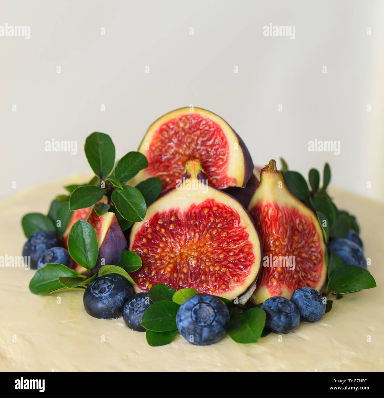 Fruit topping decoration with fig, blueberry and leaves Stock Photo - Alamy