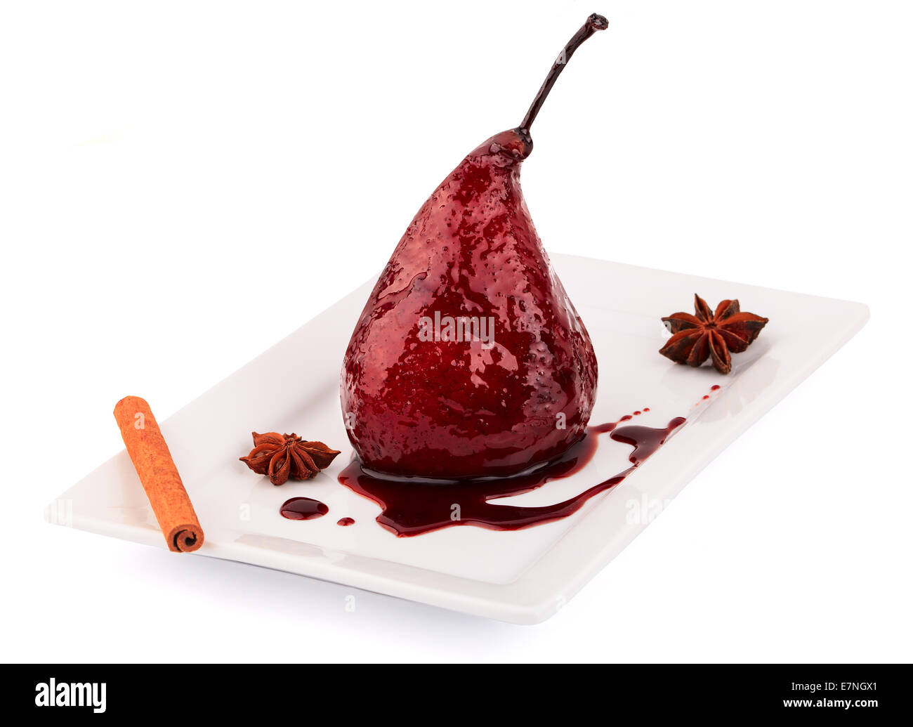 Poached pears in syrop with cinnamon isolated on white Stock Photo - Alamy