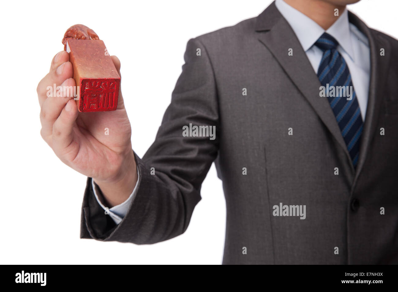 Businessman holding signet Stock Photo - Alamy