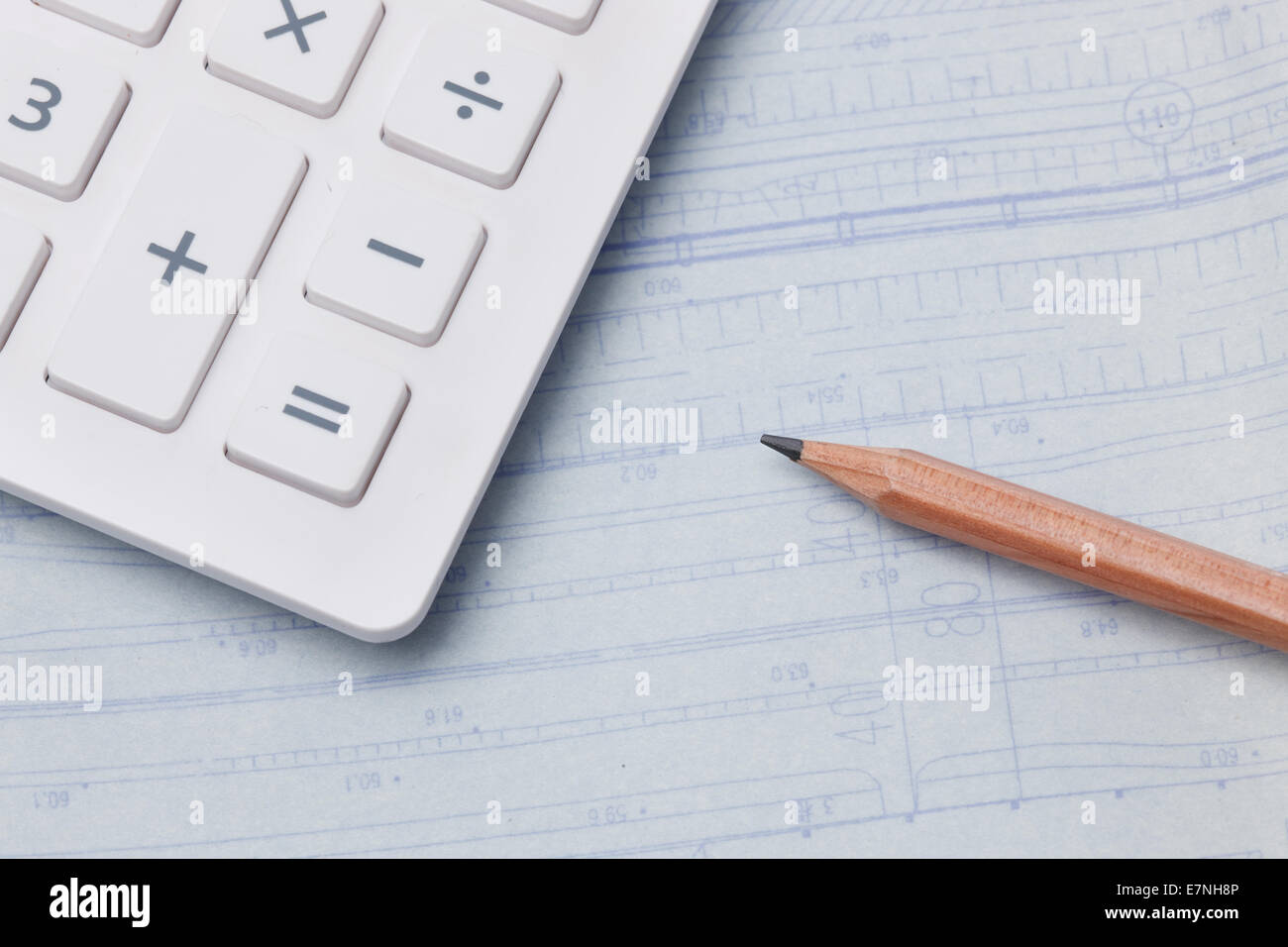 Calculator and pencil Stock Photo - Alamy