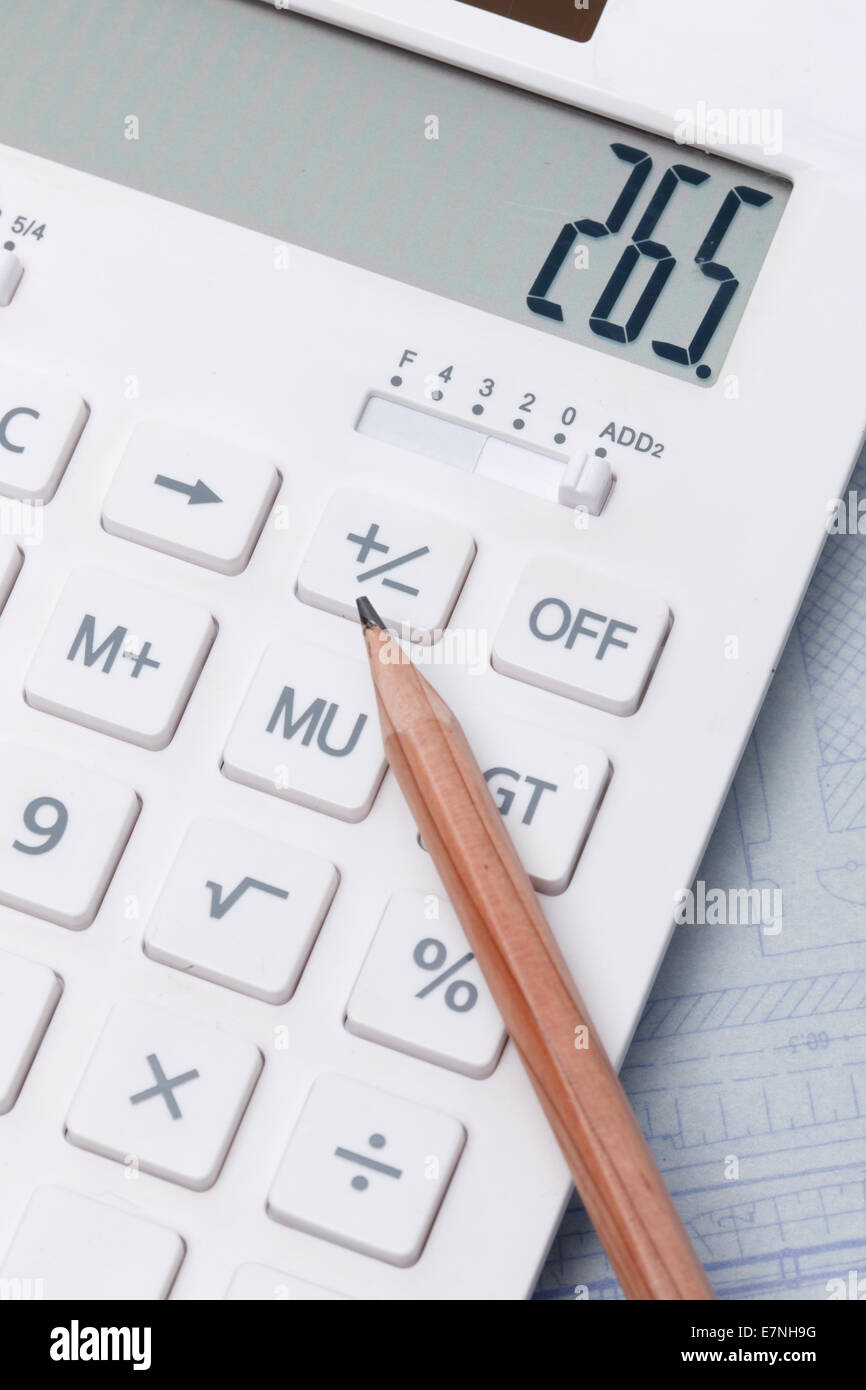 Calculator and pencil Stock Photo - Alamy