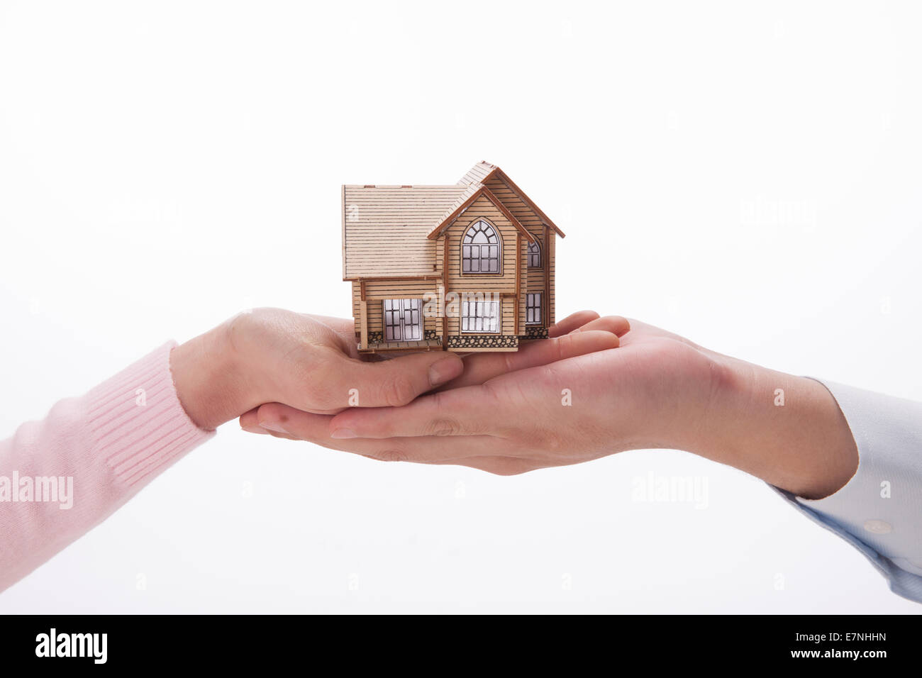 Hand holding house model Stock Photo - Alamy