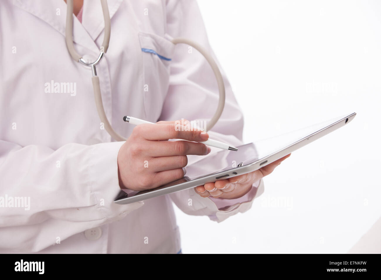 Doctor using tablet Stock Photo - Alamy