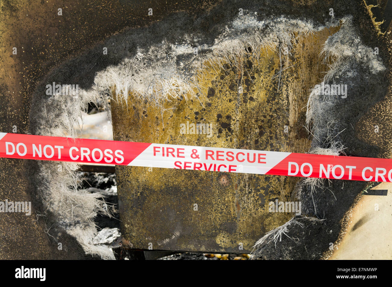 Fire and Rescue Do Not Cross tape around burnt fire scene Stock Photo ...
