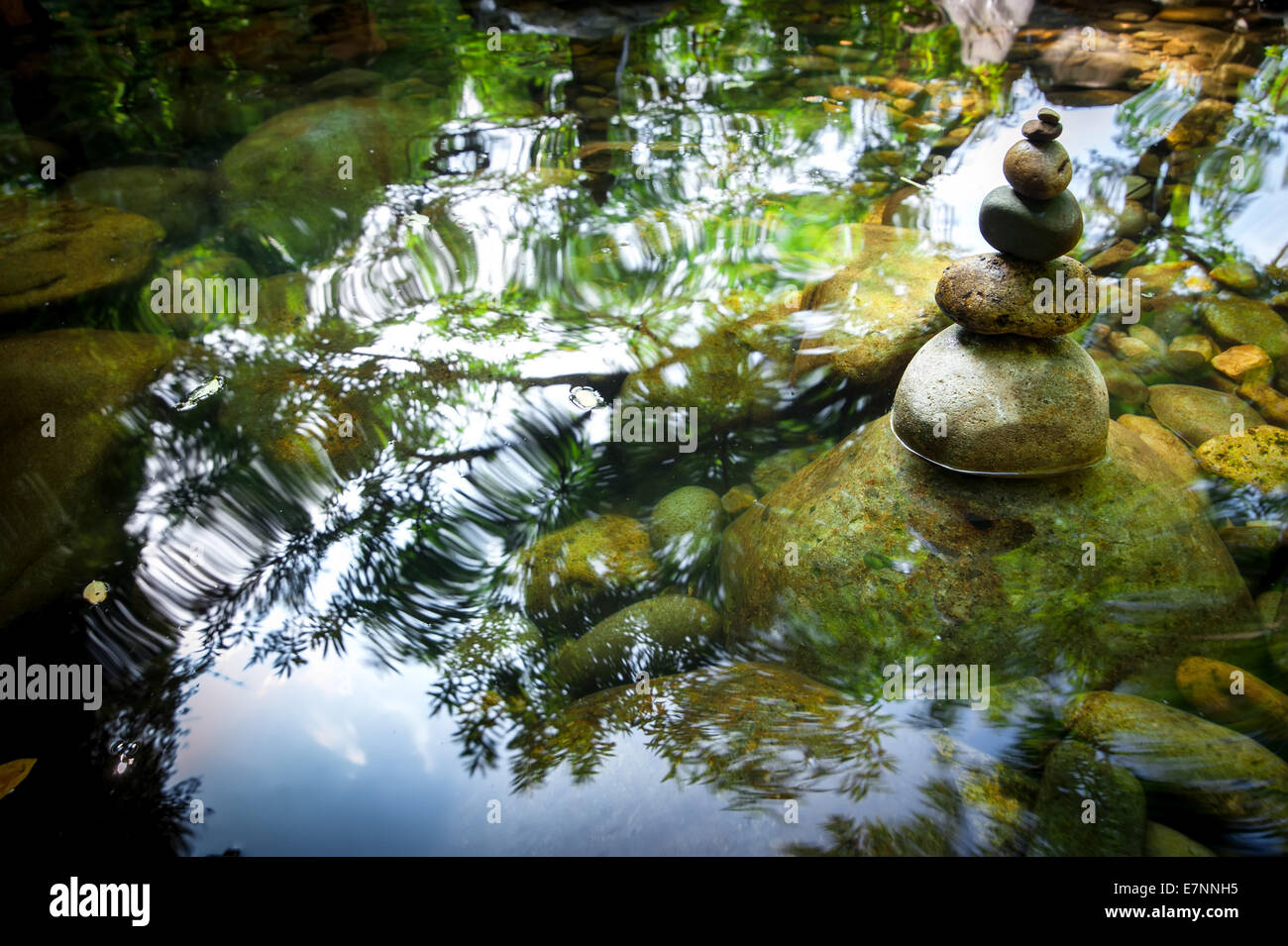 Amazing tropical rain forest landscape with lake and balancing rocks ...