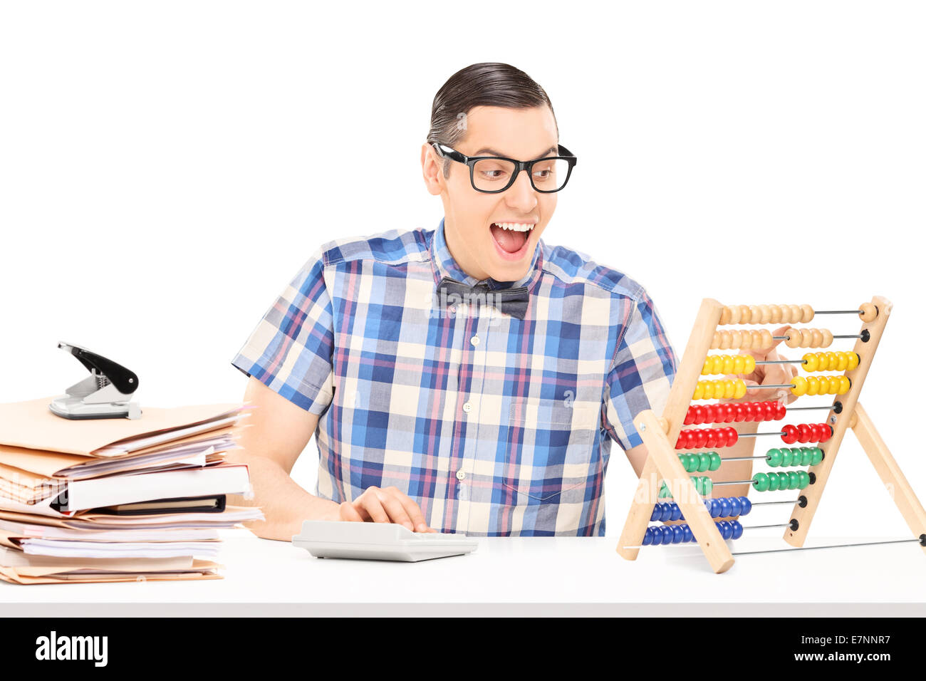 Man calculating on an abacus seated at a table isolated on white ...