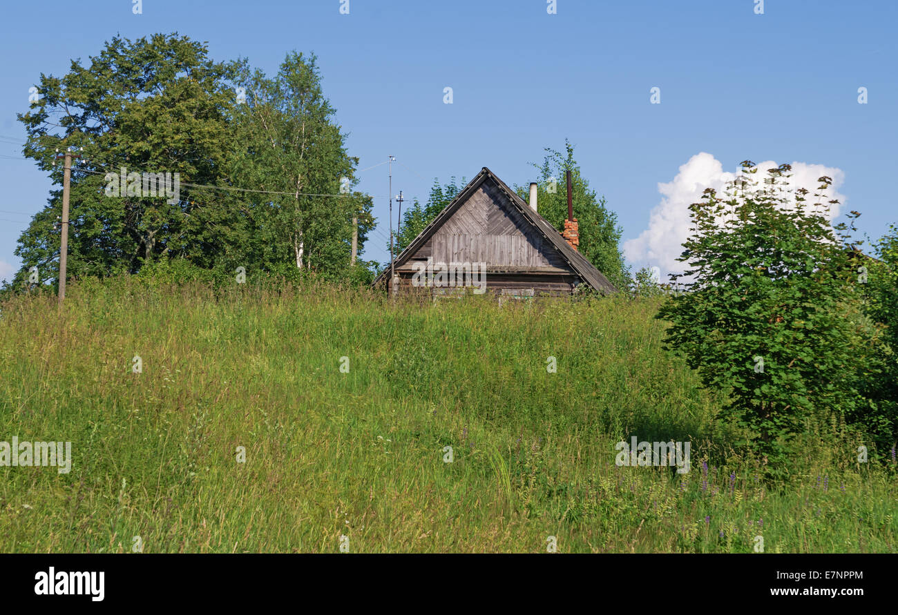 Village house on small hill Stock Photo - Alamy