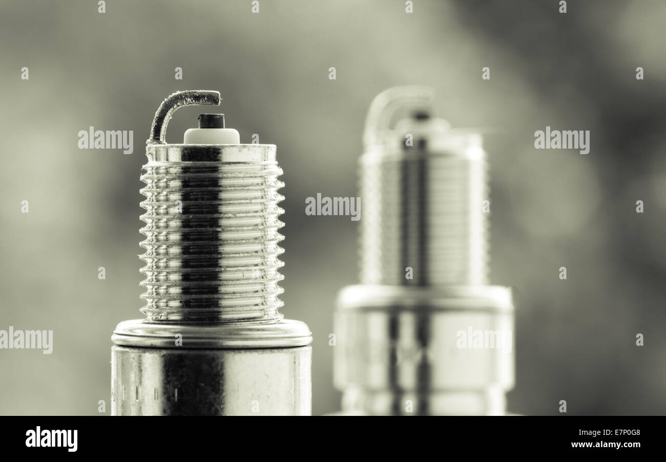 Auto service. Two new car spark plugs as spare part of auto ...
