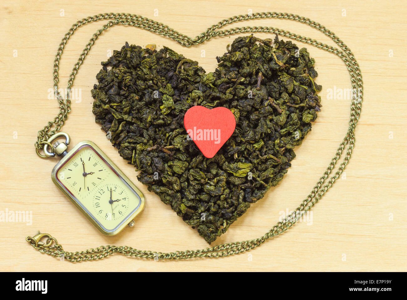 Diet healthcare tea time concept. Green tea heart shaped on wooden ...