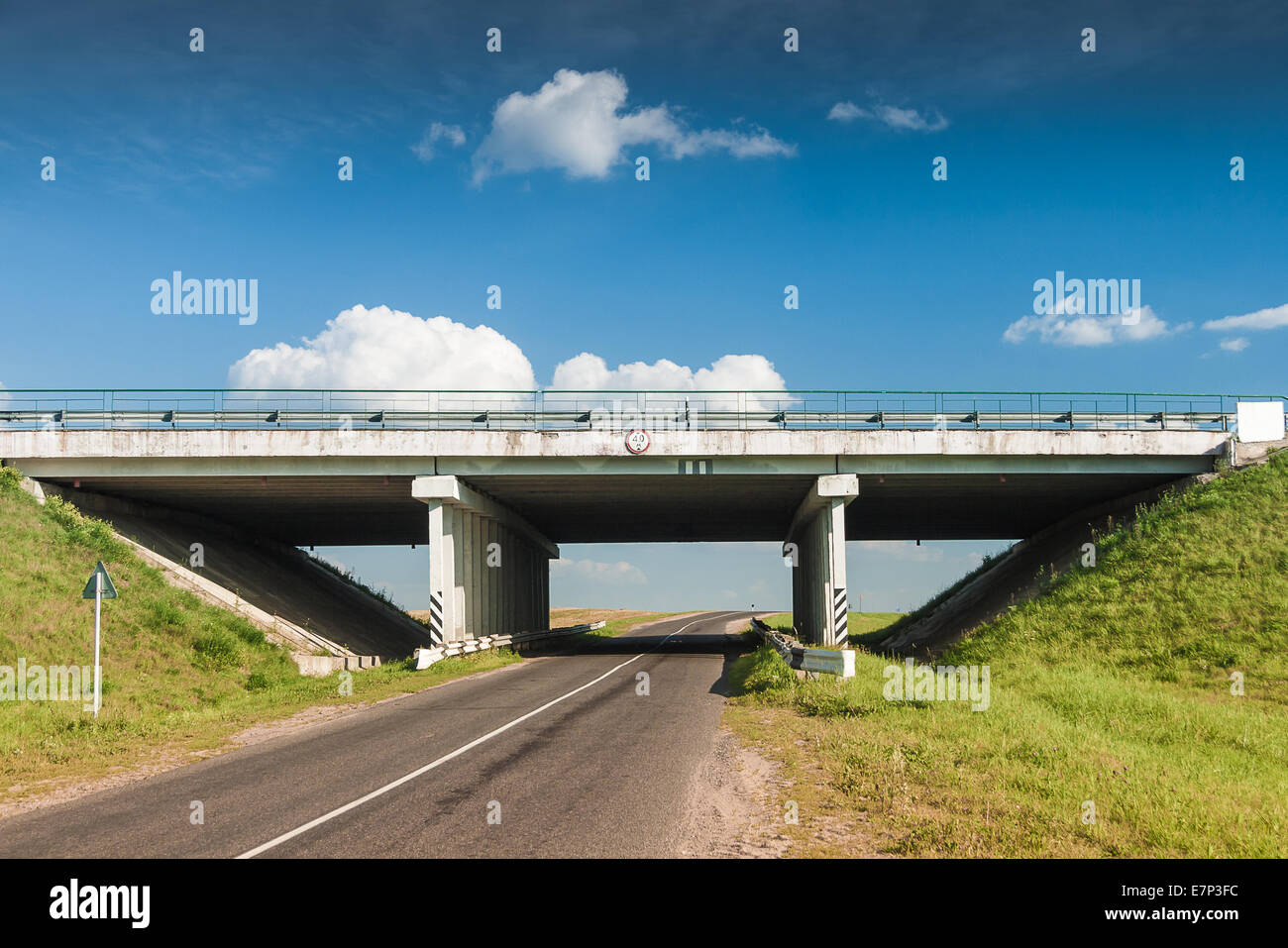 Bridge over the rural road Stock Photo - Alamy
