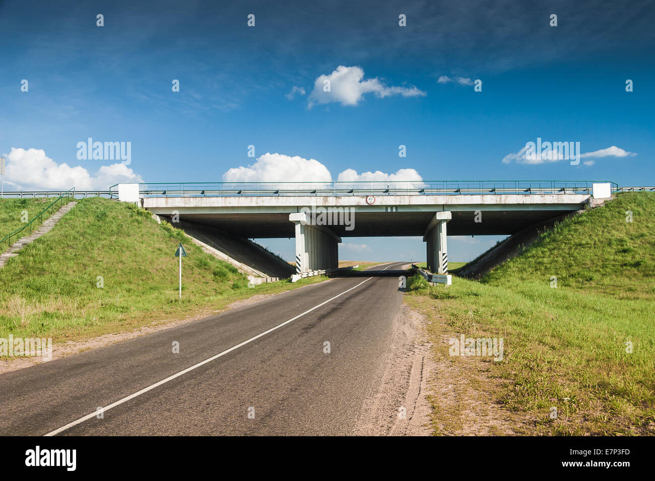 Bridge over the rural road Stock Photo - Alamy