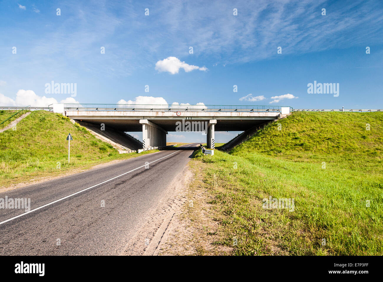 Bridge over the rural road Stock Photo - Alamy