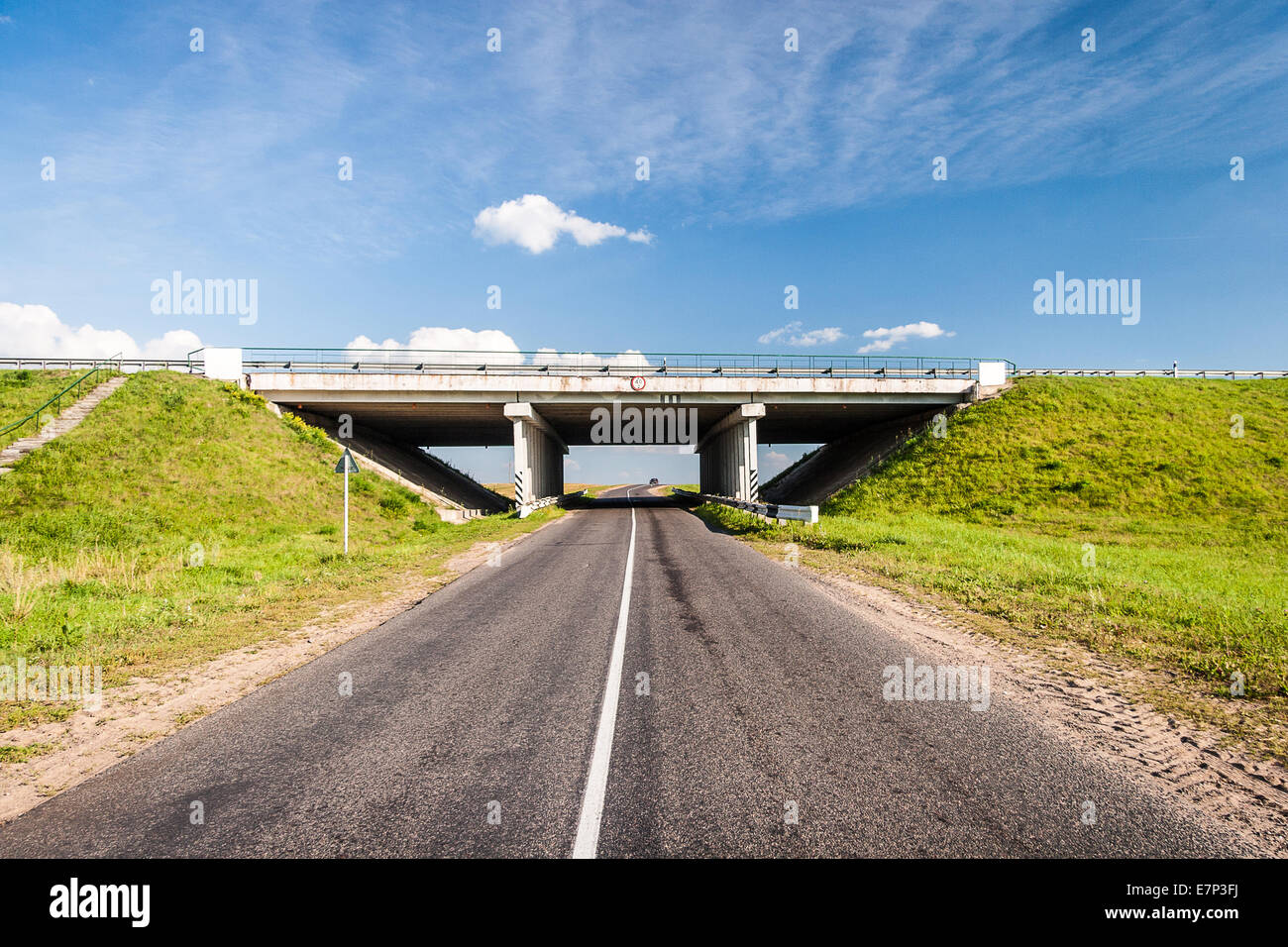 Bridge over the rural road Stock Photo - Alamy