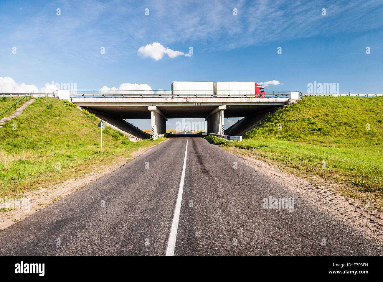 Bridge over the rural road Stock Photo - Alamy