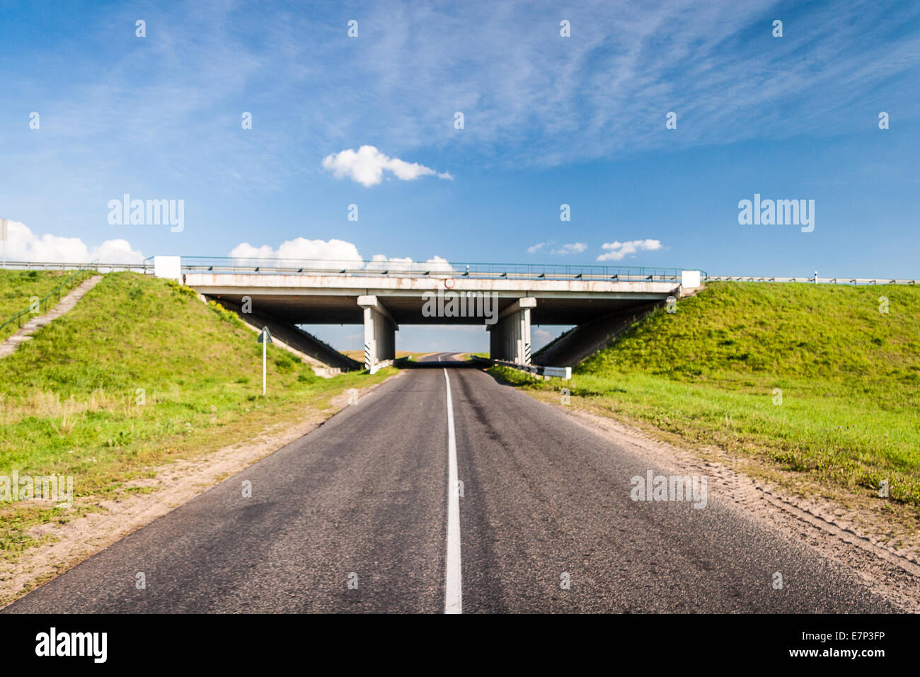 Bridge over the rural road Stock Photo - Alamy