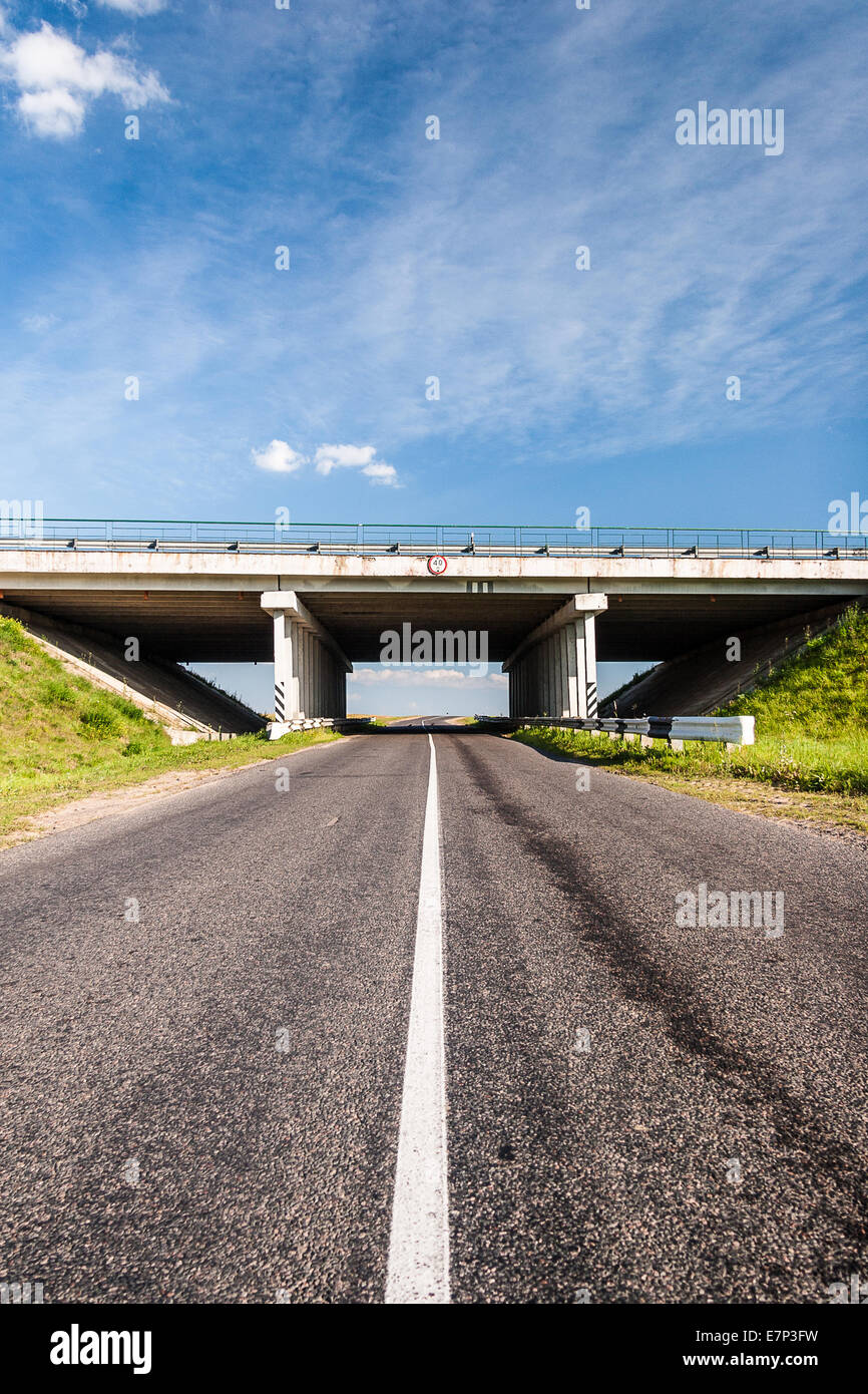 Bridge over the rural road Stock Photo - Alamy