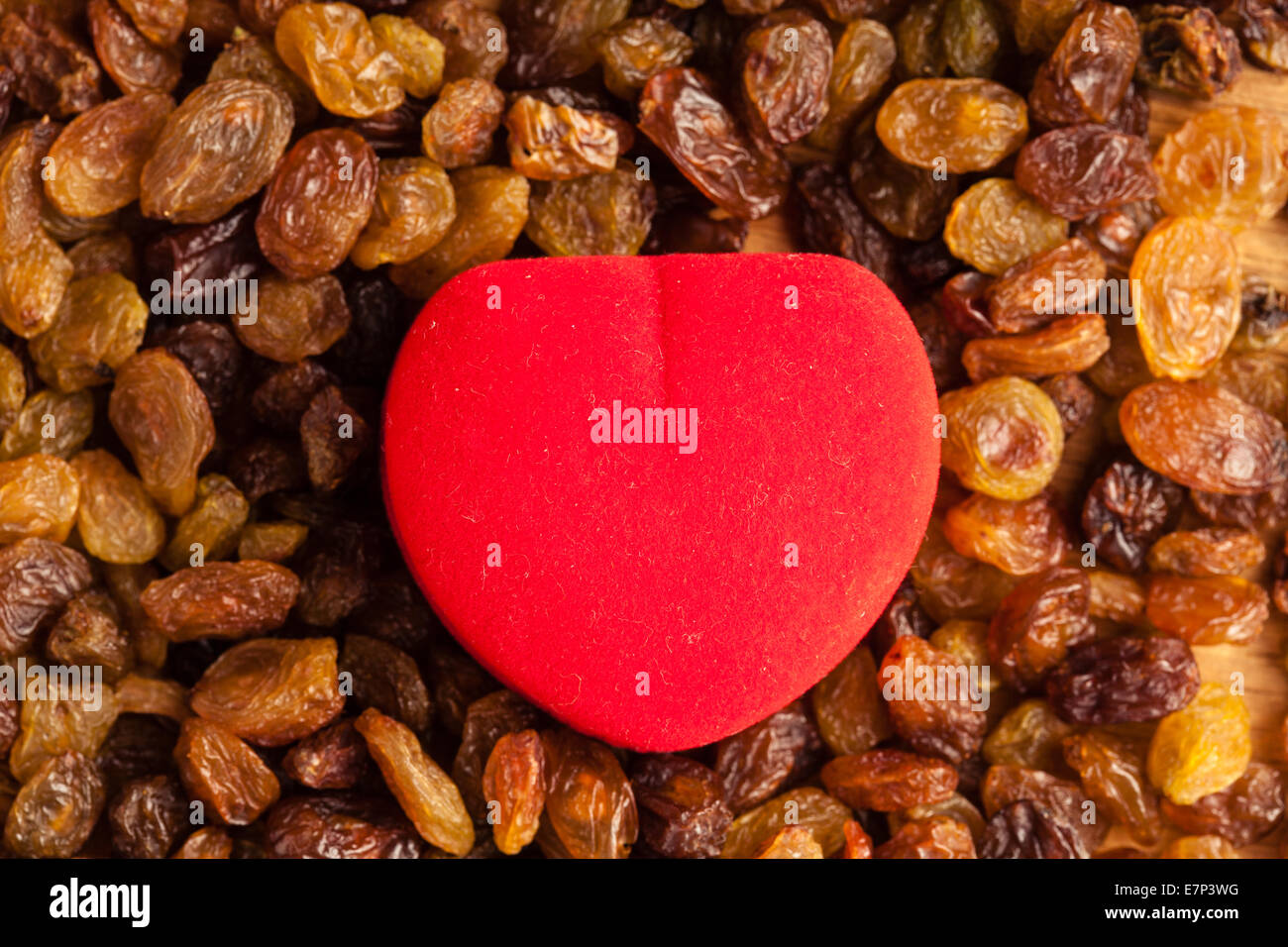 Health care healthy food organic nutrition. Red heart on raisin ...