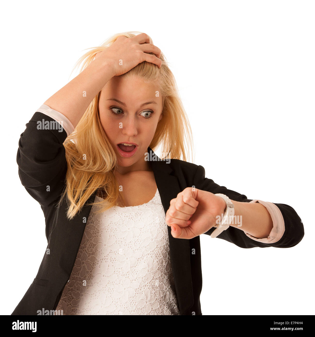 Young blonde woman looks at her watch when she is being late isolated ...