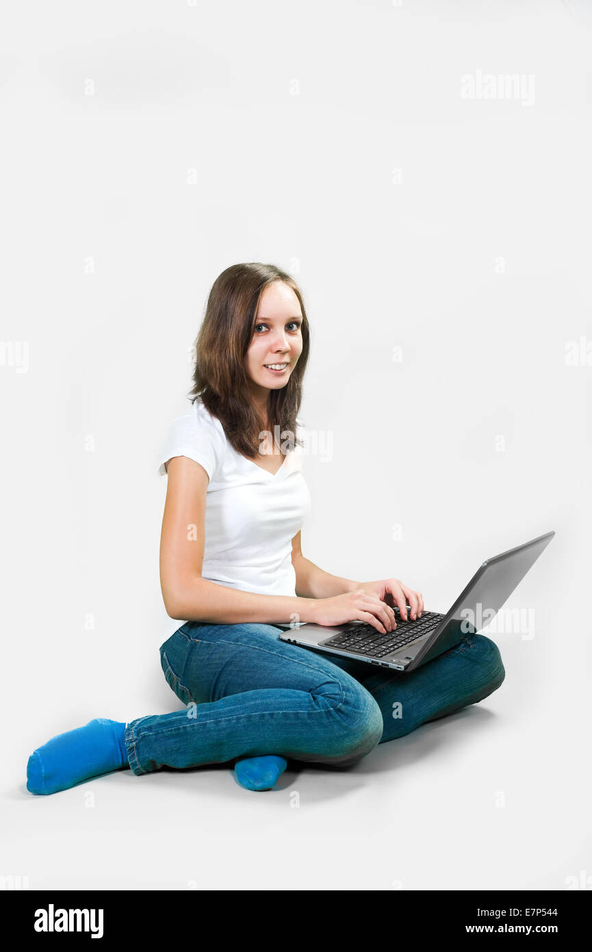 Girl with Laptop computer isolated on gray background Stock Photo - Alamy