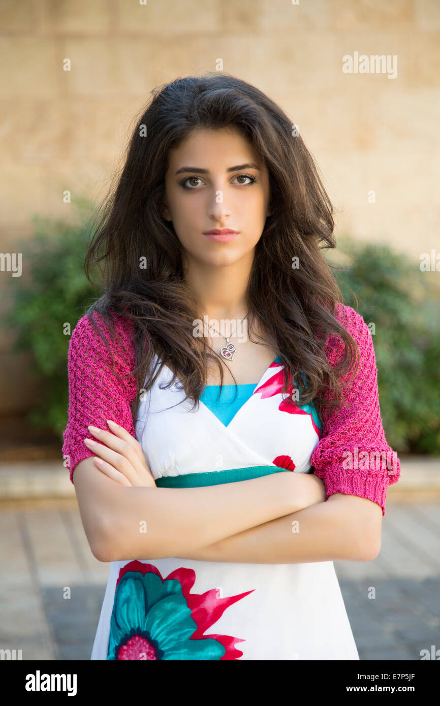 Woman standing with arms folded hi-res stock photography and images - Alamy