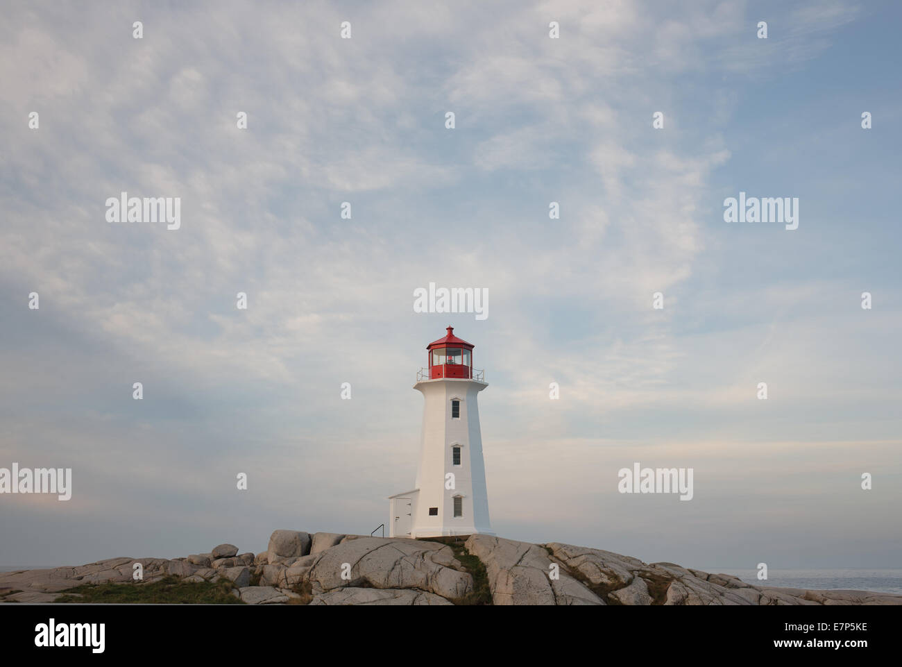 Lighthouse on rocks and blue sky Stock Photo - Alamy