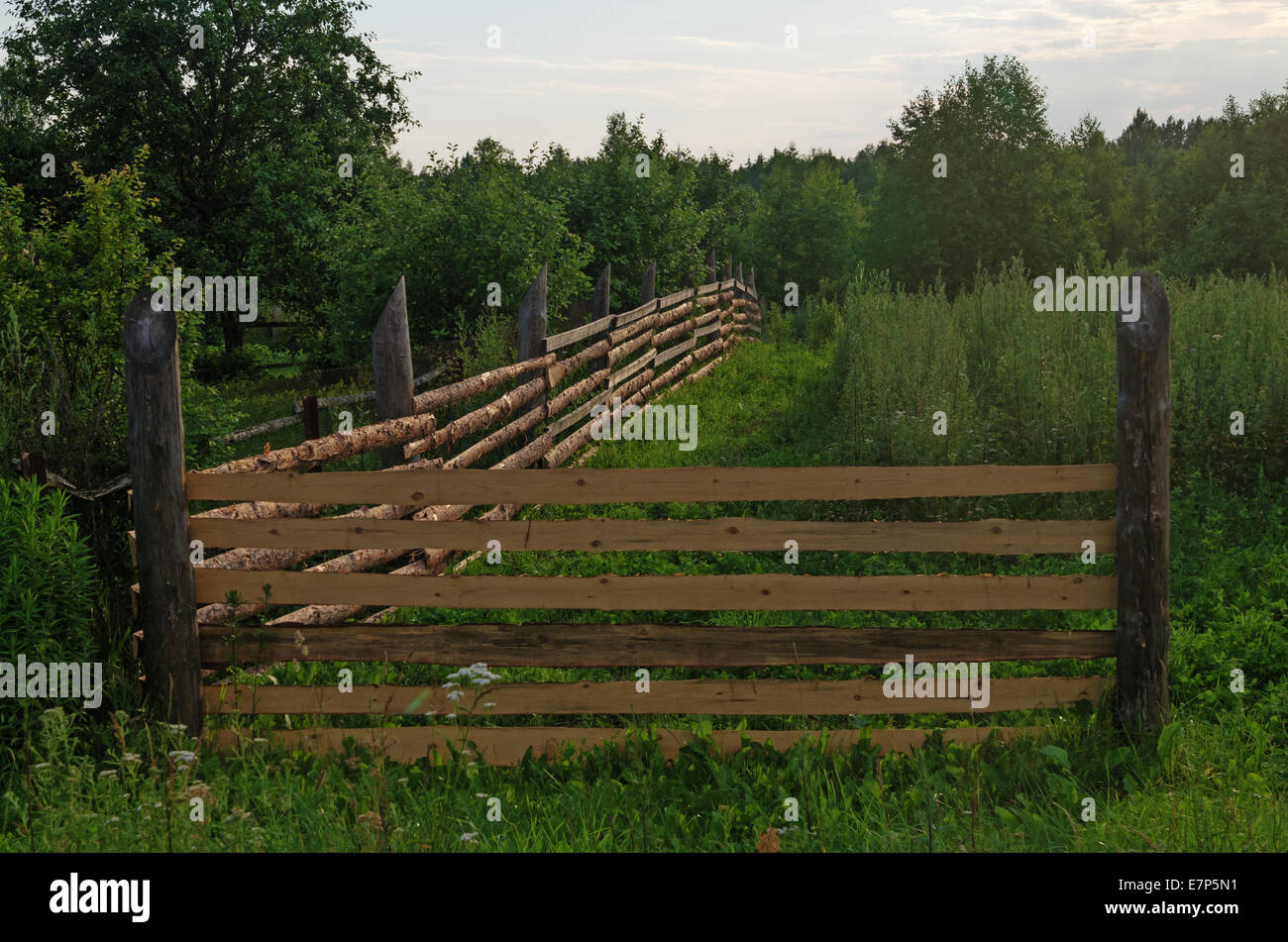 Wooden fence in village Stock Photo - Alamy
