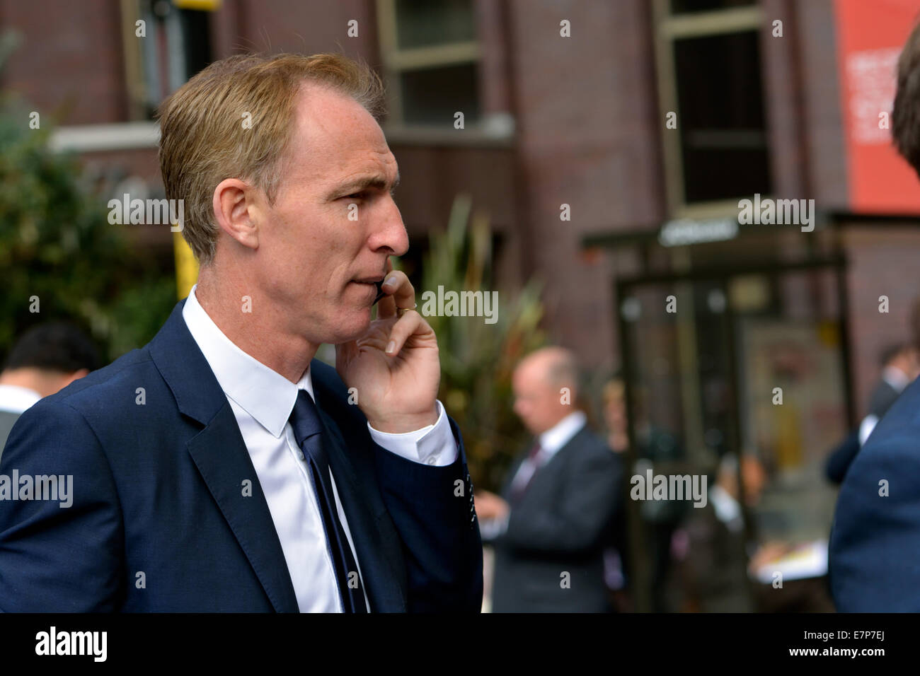 Manchester UK 22nd September 2014 Labour MP Jim Murphy is on his mobile ...