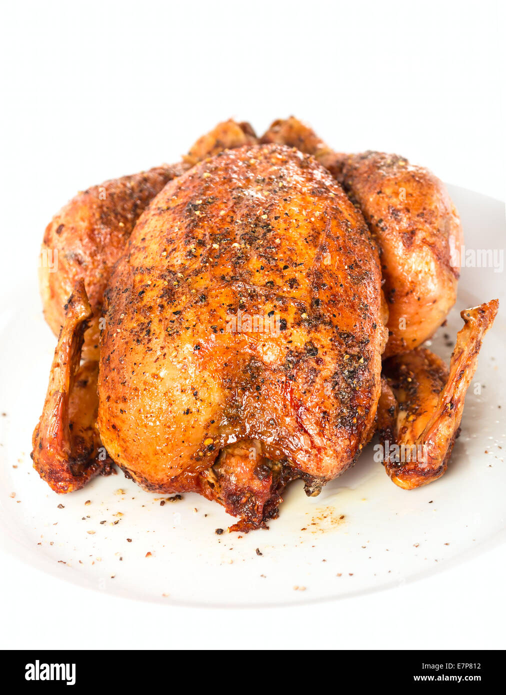 Roasted chicken hot on a plate white Stock Photo - Alamy