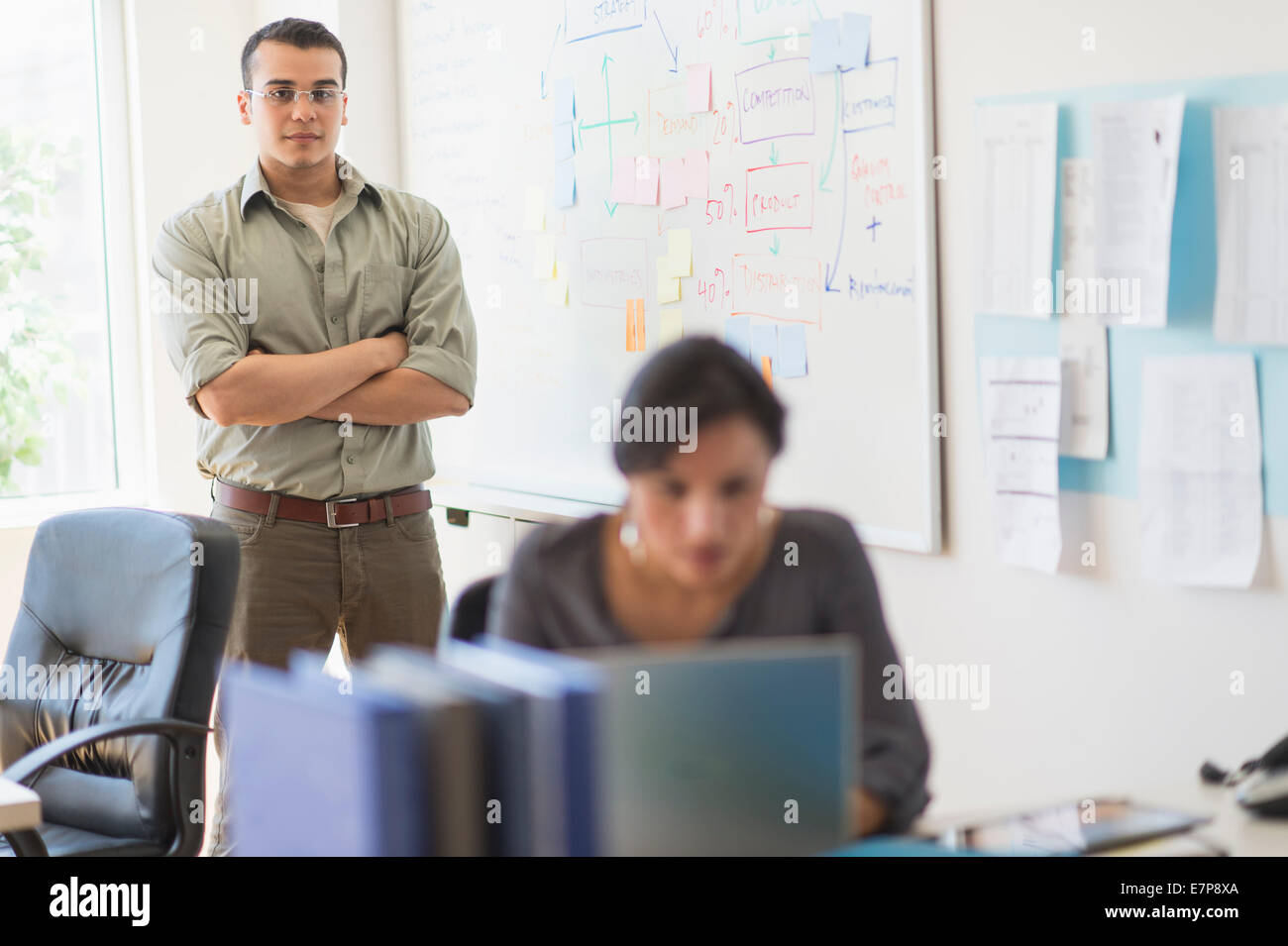 Two people working in office Stock Photo - Alamy