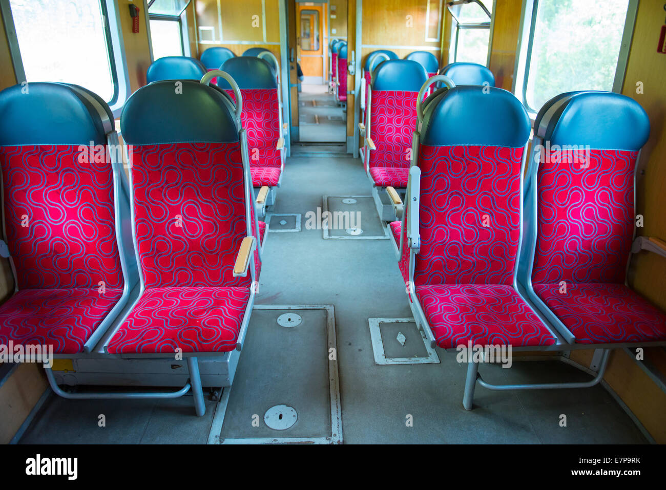 Interior of a modern train with windows and empty red seats Stock Photo ...