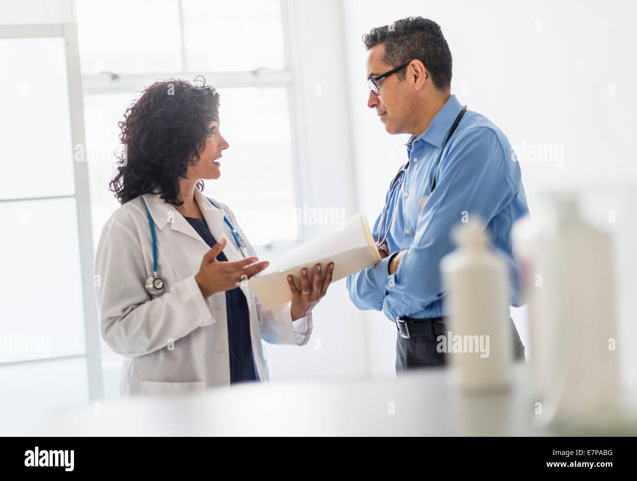 Female and male doctors working together Stock Photo - Alamy
