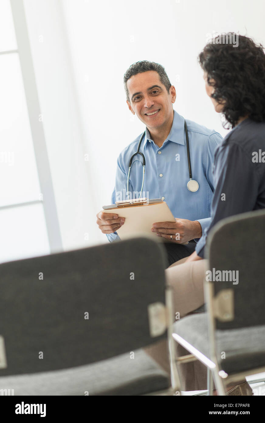 Doctor with patient Stock Photo - Alamy