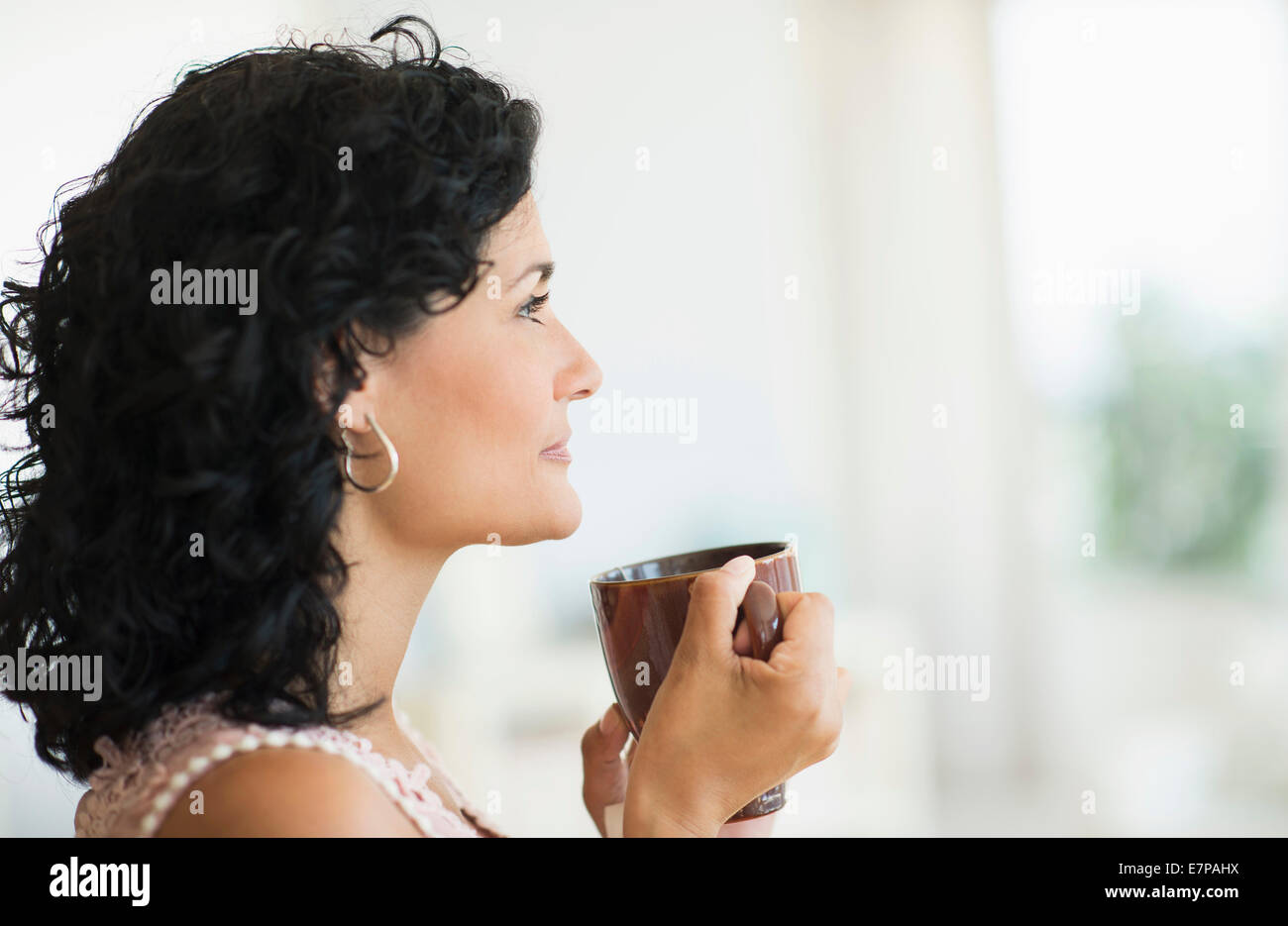 Woman enjoying her tea Stock Photo - Alamy