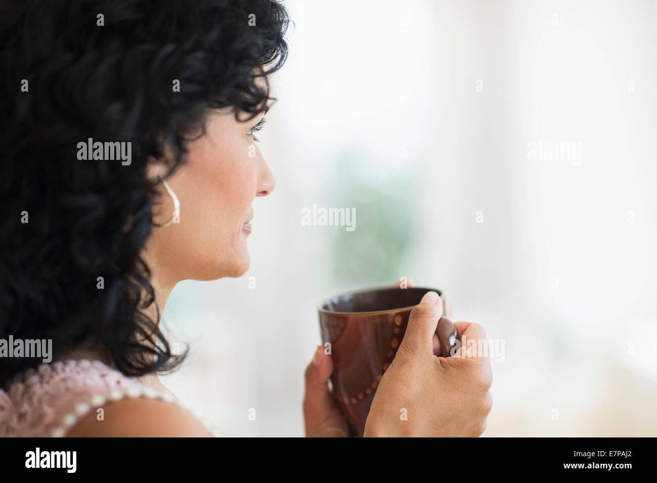 Woman enjoying her tea Stock Photo - Alamy