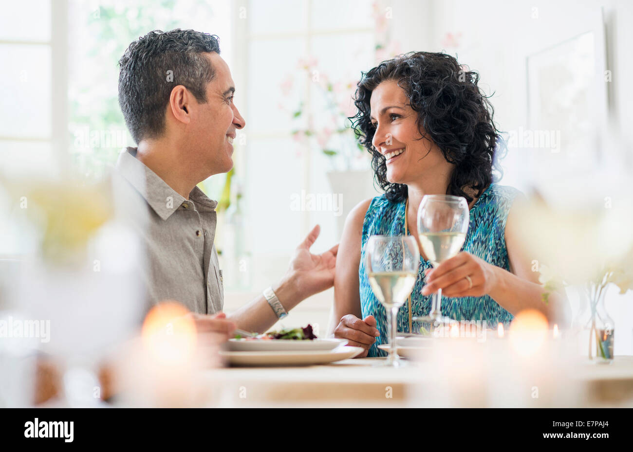 Couple dining in restaurant Stock Photo - Alamy