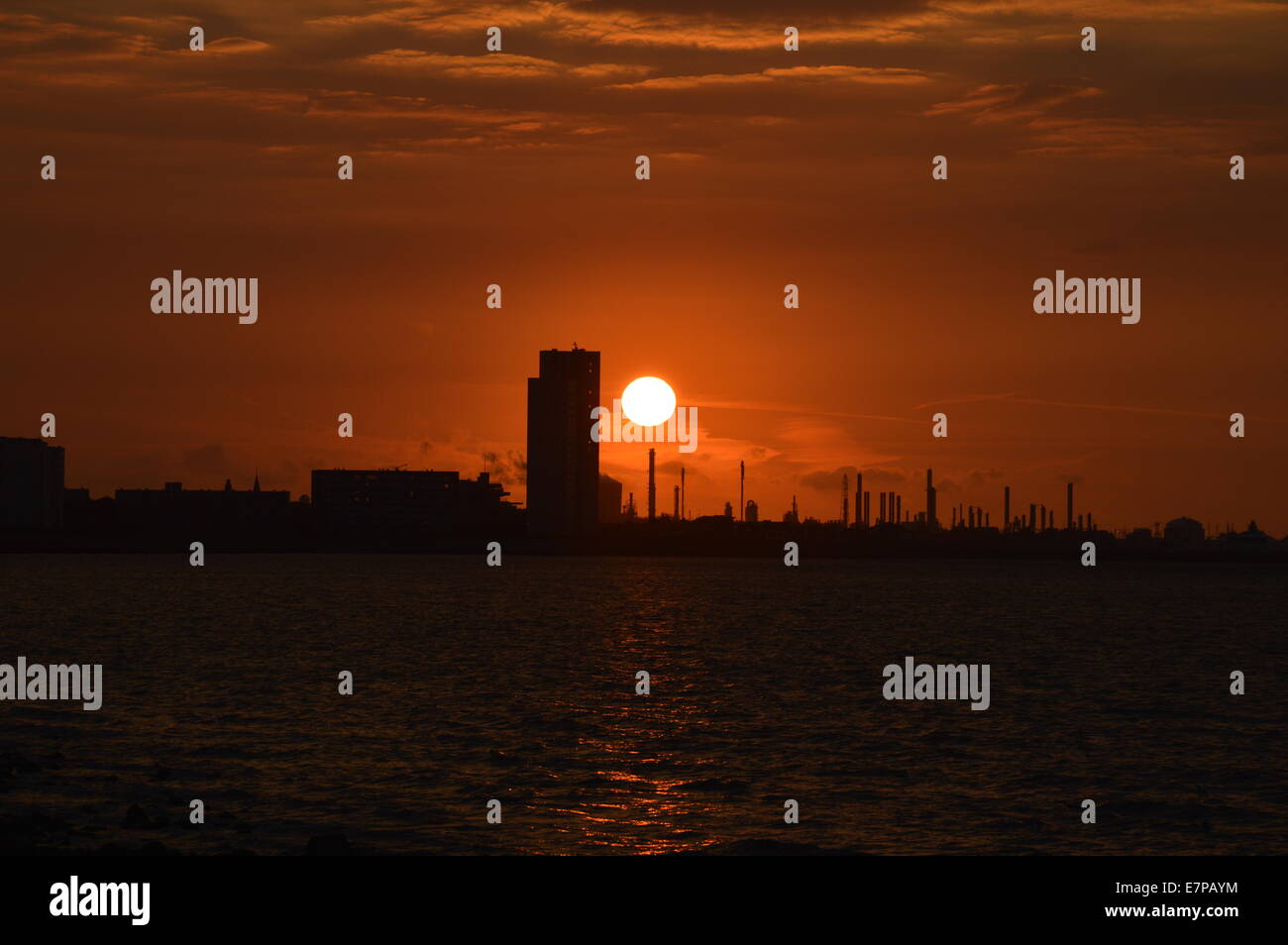 Beautiful sunset with city as background Stock Photo - Alamy