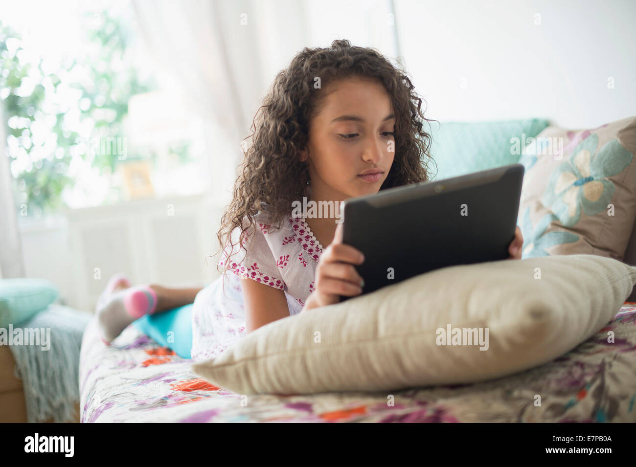 African american girl using digital hi-res stock photography and images ...