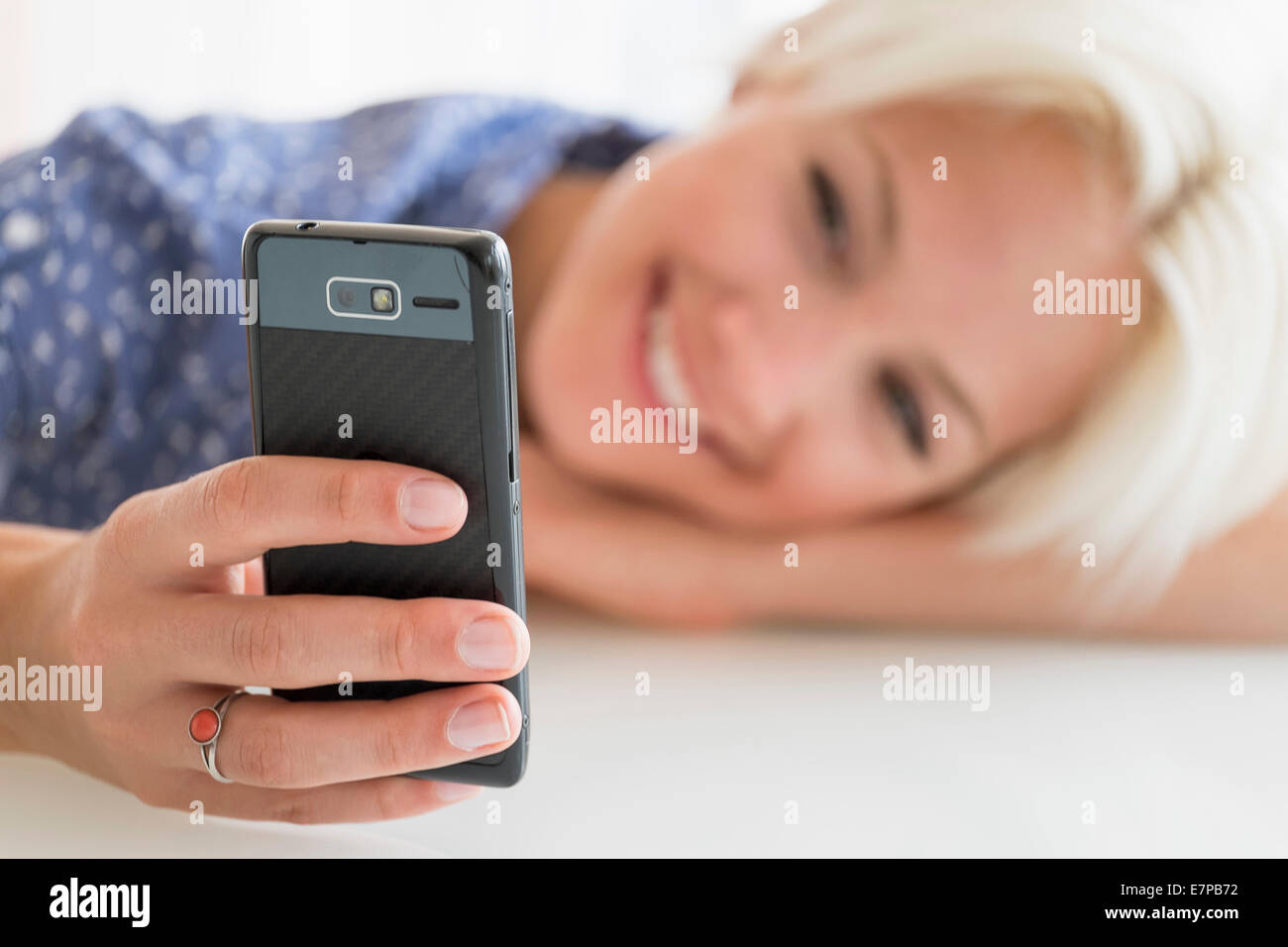 Woman using cell phone Stock Photo - Alamy