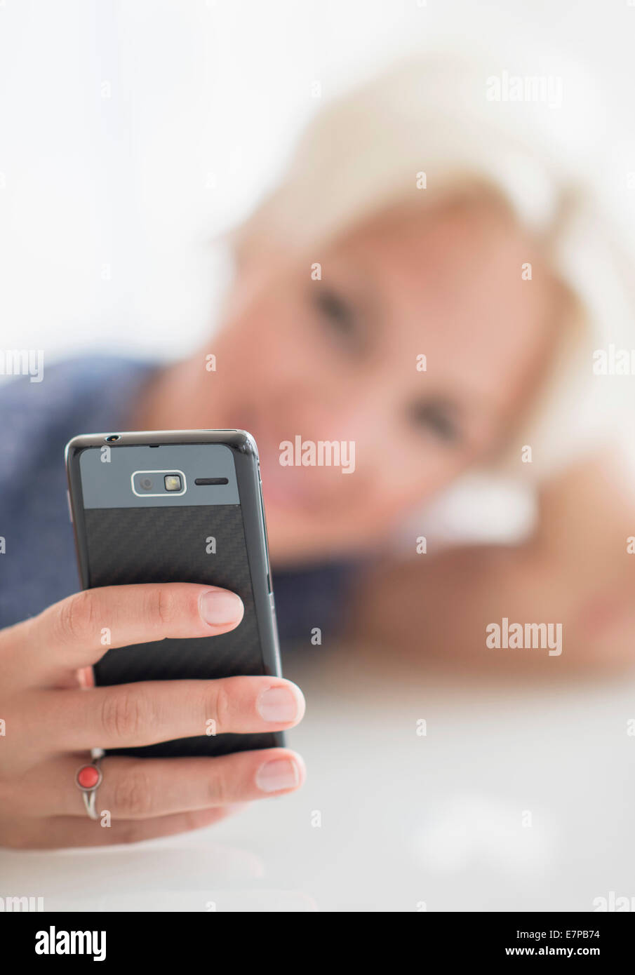 Woman using cell phone Stock Photo - Alamy