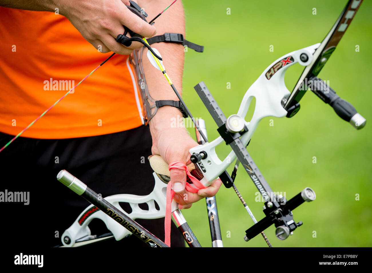 This archer is preparing this longbow to get ready to shoot some arrows ...