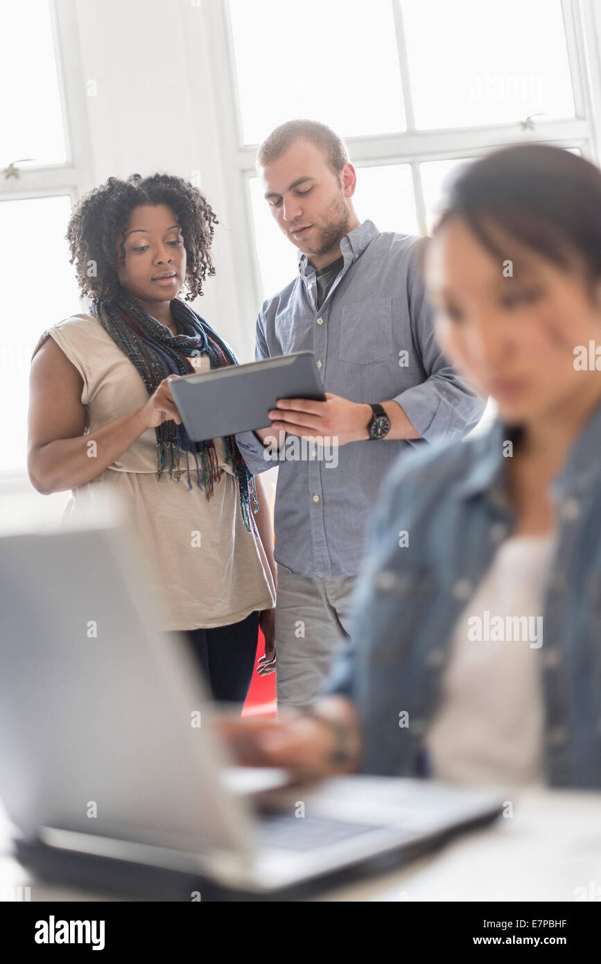 Man and women working in office Stock Photo - Alamy