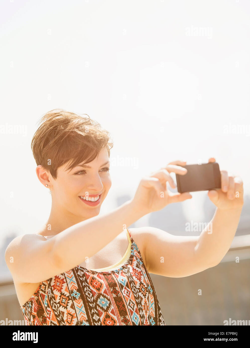 Woman smiles taking selfie hi-res stock photography and images - Alamy