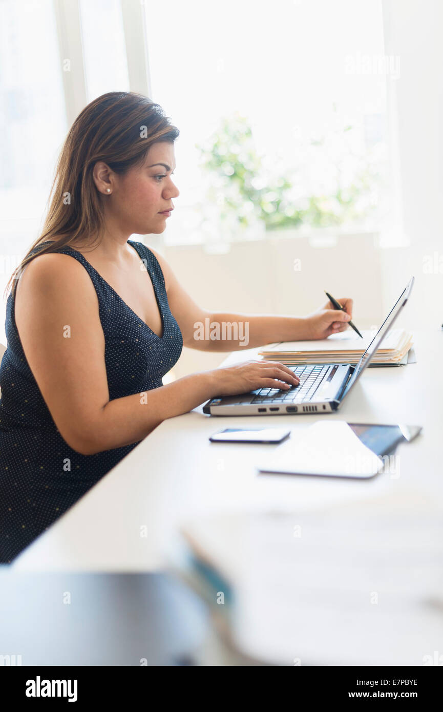 Woman working in home office Stock Photo - Alamy
