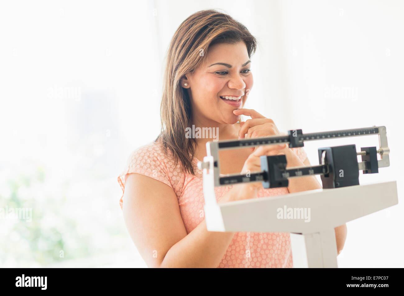 Caucasian woman standing on scale hi-res stock photography and images ...