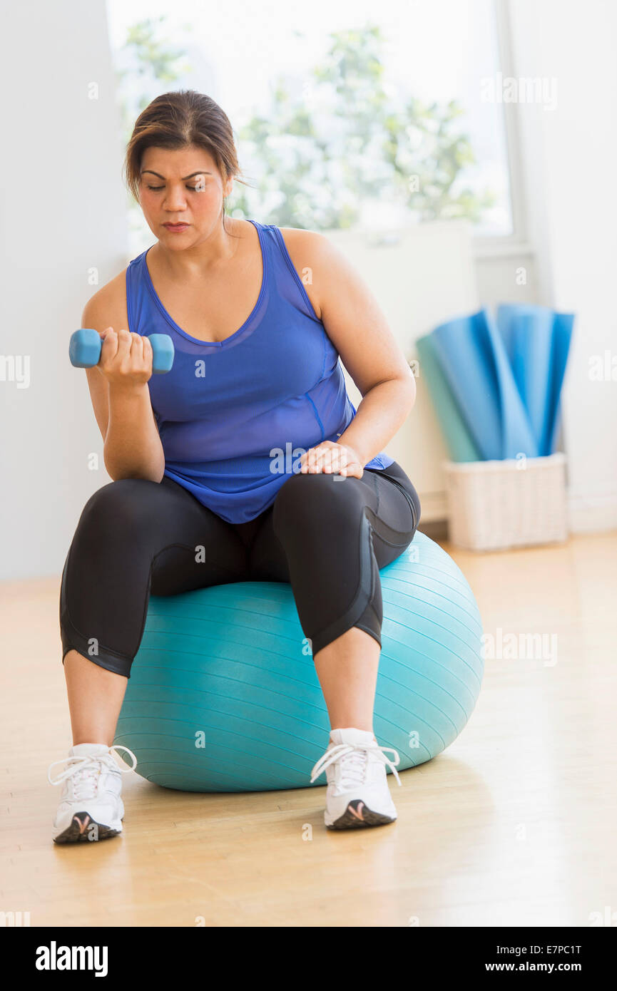 Overweight woman sitting gym ball hi-res stock photography and images ...